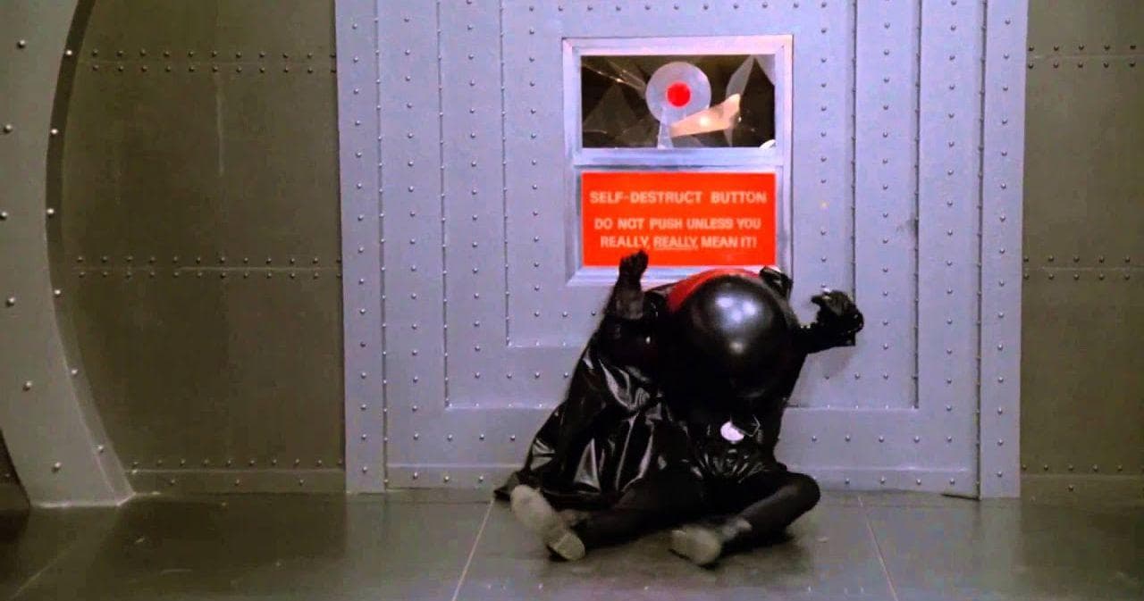 14 Times Movie Characters Actually Press The 'Big Red Button'