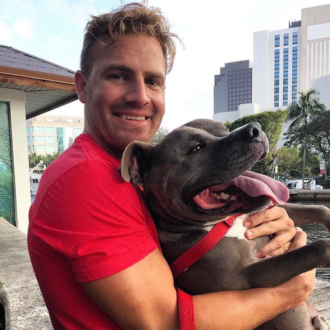 17 Adorable Pics Of NFL Players With Small Dogs, Ranked By Cuteness