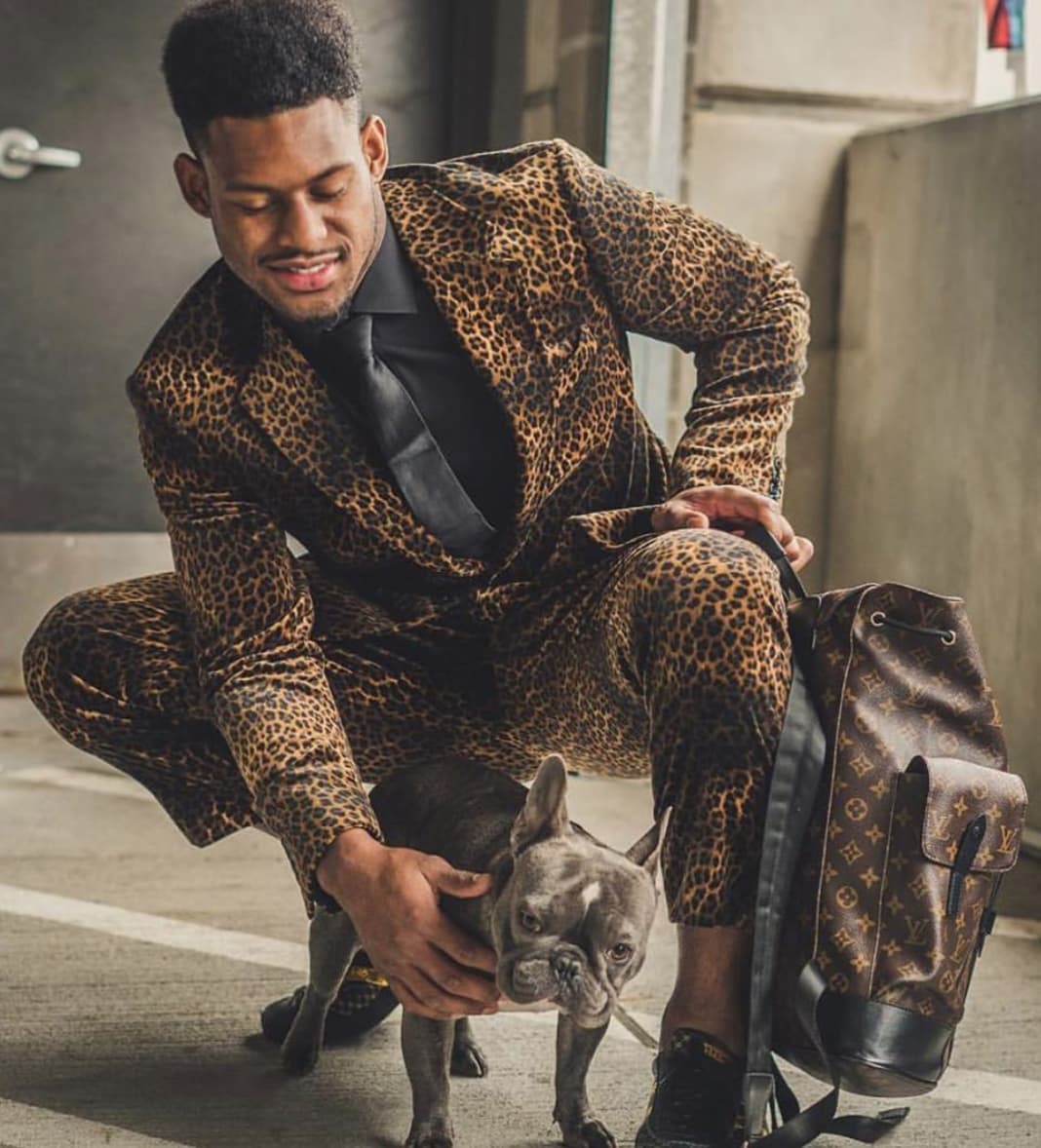 17 Adorable Pics Of NFL Players With Small Dogs, Ranked By Cuteness