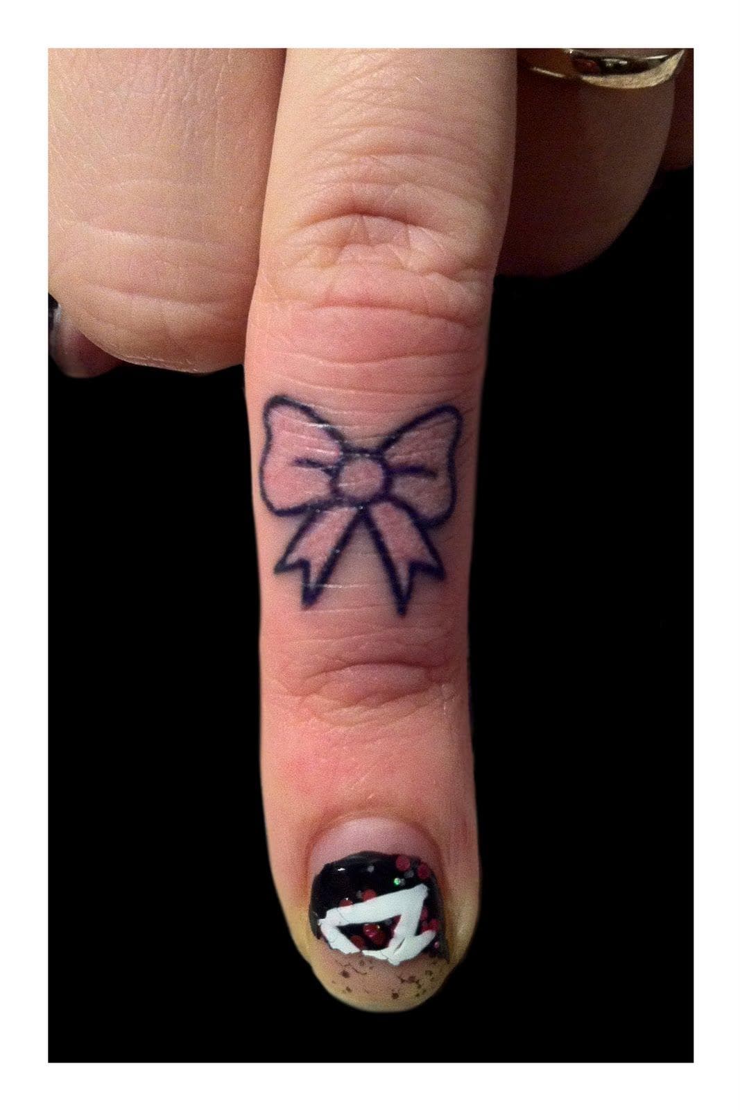 Bow Finger Tattoos