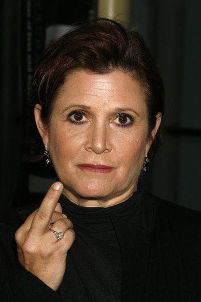 12 Epic Pictures Of Carrie Fisher Giving People The Middle Finger